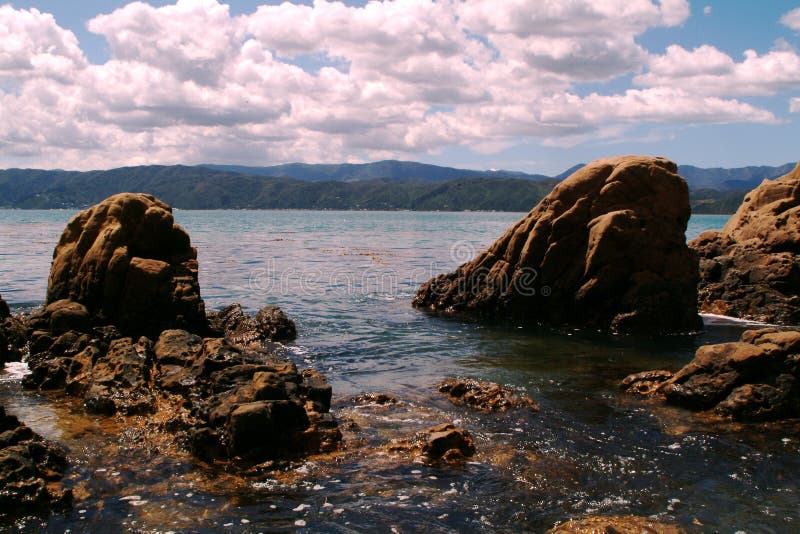 Rocks on Coastline stock photo. Image of clouds, ocean - 665580