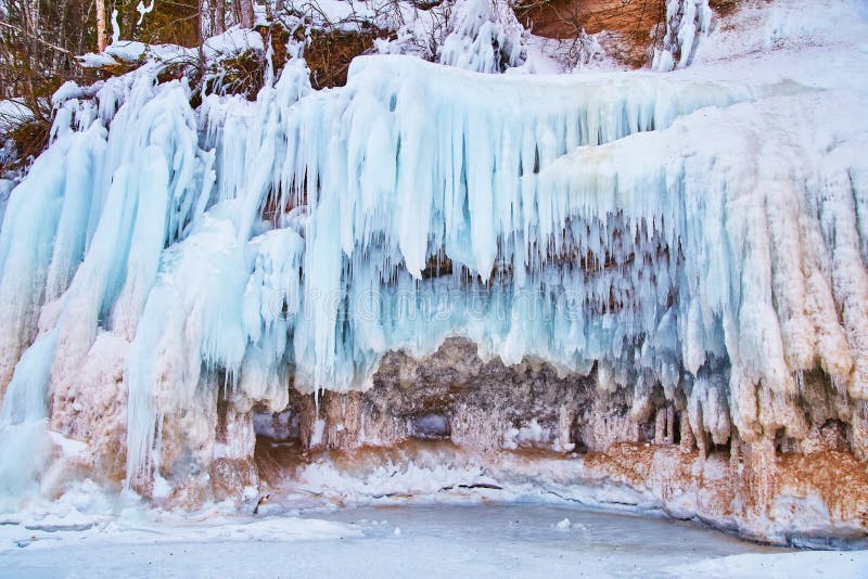 Rocks Completely Frozen Over with Ice Formations of Blue in Winter ...