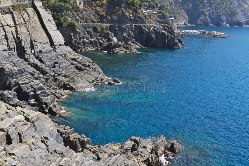 Rocks Descend into the Clear Blue Water Stock Photo - Image of rocks ...