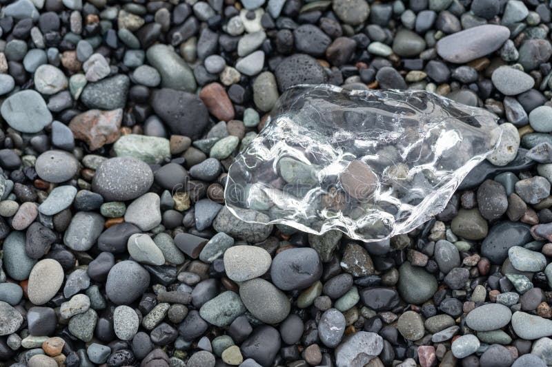 Rocks at Diamond Beach, with a Melting Ice Chunk. Iceland Stock Photo ...