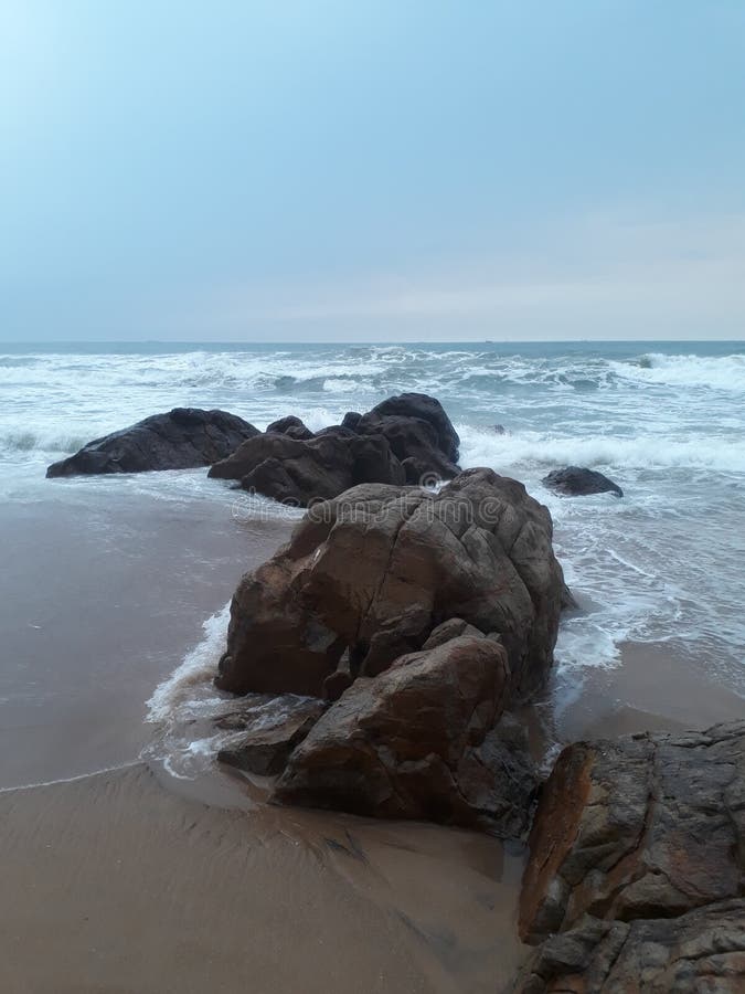 Rocks facing ocean stock photo. Image of front, ocean - 115857080