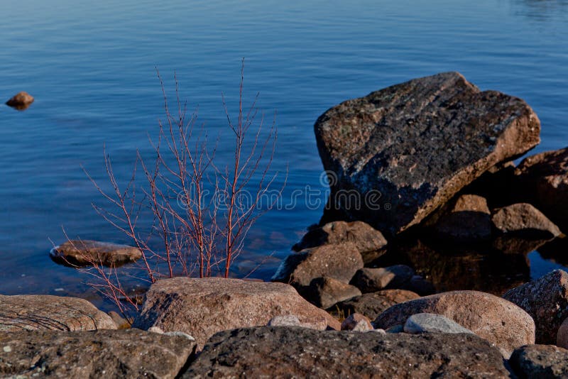 Rocks in harbour stock photo. Image of small, sunny, blue - 52705684