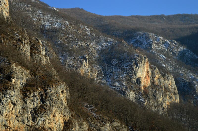 Rocks and hills in winter stock image. Image of rock - 169624283