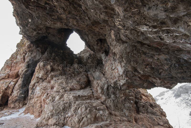 Rocks with through holes stock photo. Image of rocky - 239899694