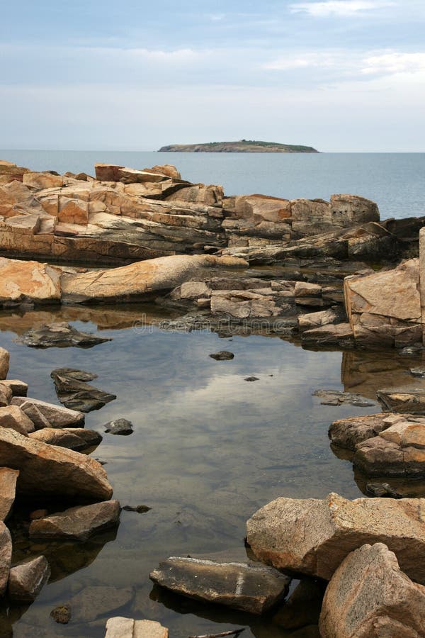 Rocks and island 2 stock image. Image of tranquil, beach - 55996055