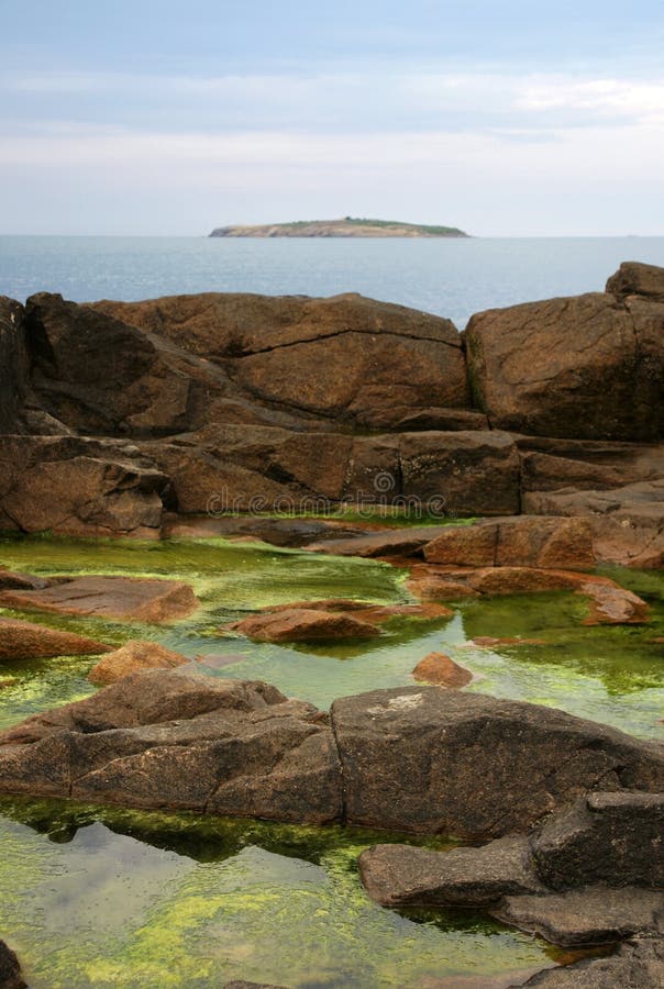 Rocks and island 1 stock photo. Image of purity, horizon - 55996434