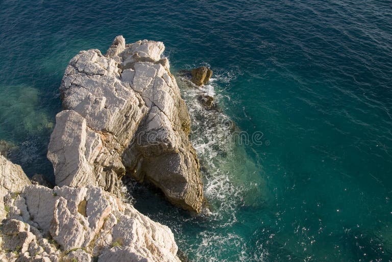 Rocks jutting out into sea stock image. Image of danger - 3195647
