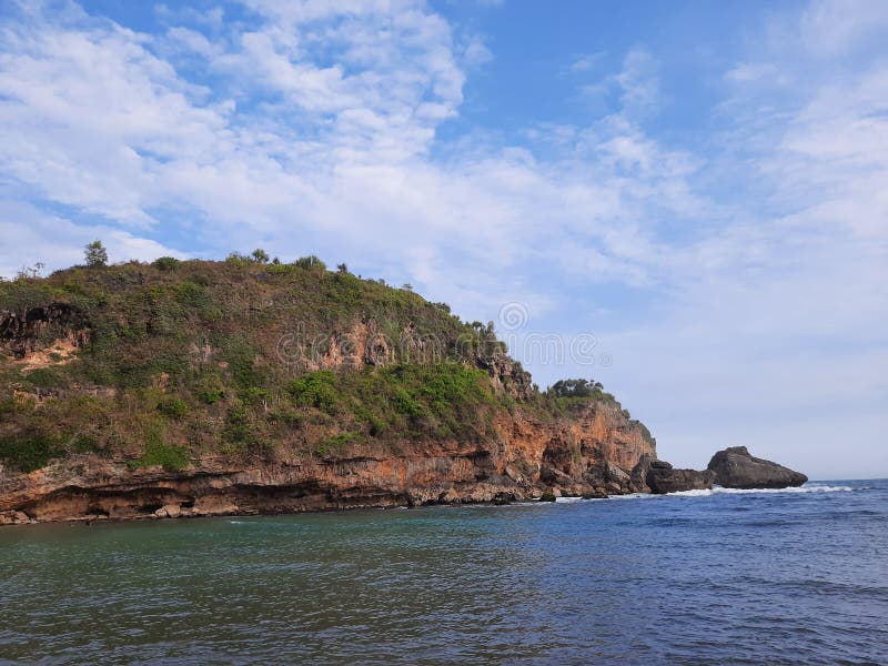 Rocks jutting into the sea stock photo. Image of rocks - 263558494
