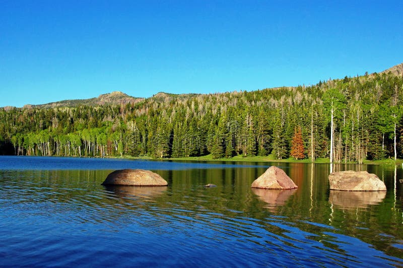 Rocks in Lake stock image. Image of blue, outdoors, water - 14897865