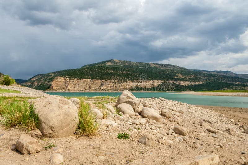 Rocks by the Lake stock image. Image of cloud, geography - 89307299