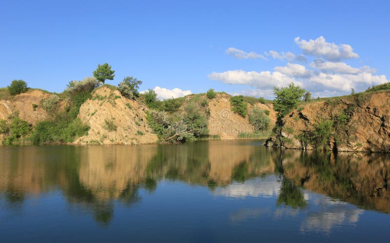 Rocks on lake stock image. Image of blue, nature, dark - 31296779