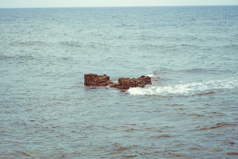 Rocks ledges by the sea stock image. Image of inspiration - 219578617