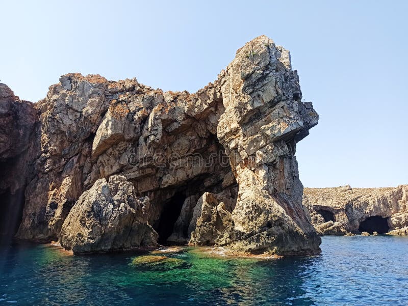 Rocks on Menorca coast stock photo. Image of spain, clear - 328774286