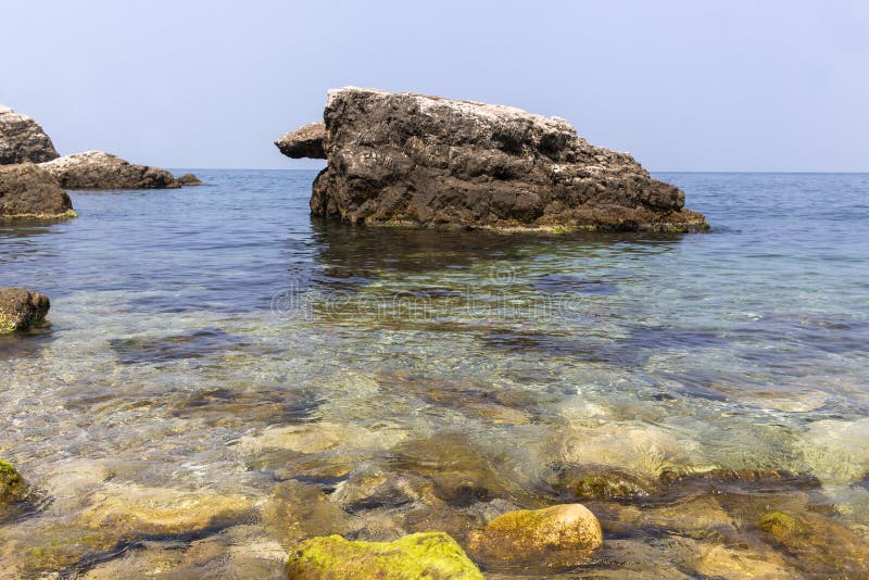 Rocks, Mossy Stones and Sparkling Sea Water in the Sea Stock Photo ...