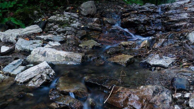 Rocks in the Mountains with Water Flowing Stock Photo - Image of ...