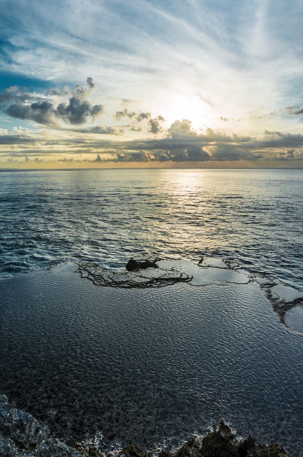 Rocks Near the Sea. Sunset Sky Reflected in the Pools Stock Image ...