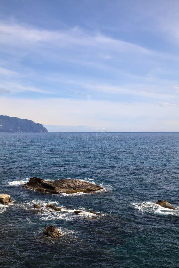 Rocks Next To a Cliff by the Sea on a Sunny Day Stock Photo - Image of ...
