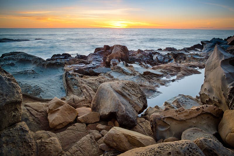Rocks and Ocean stock image. Image of sunsets, colors - 38840265