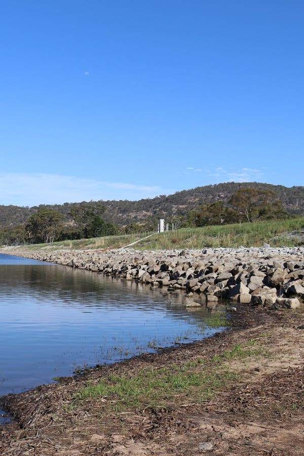 Rocks Placed at the Edge of a Lake during Construction Stock Photo ...