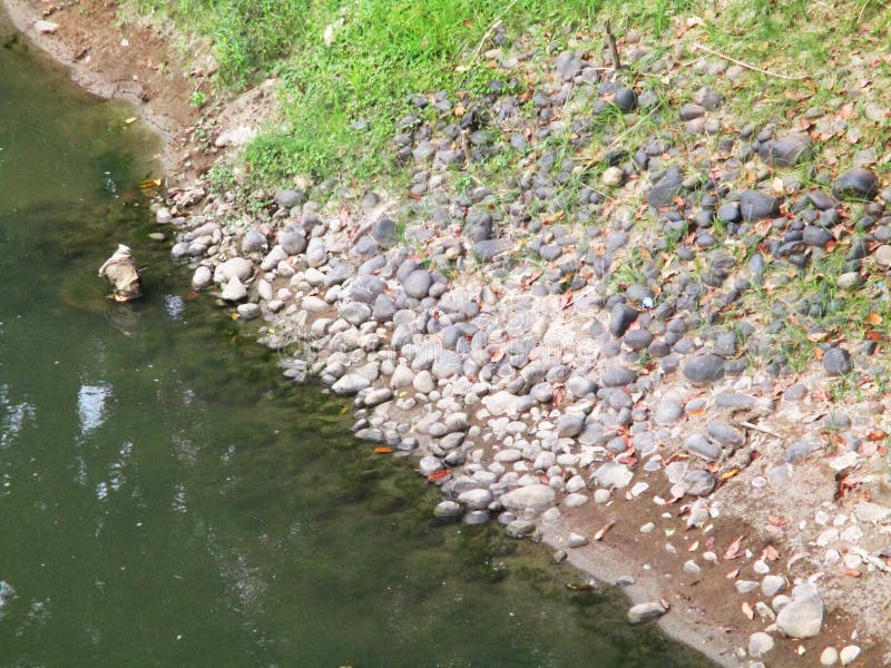 Rocks beside the River Under an Old Bridge Used for Plantations and ...