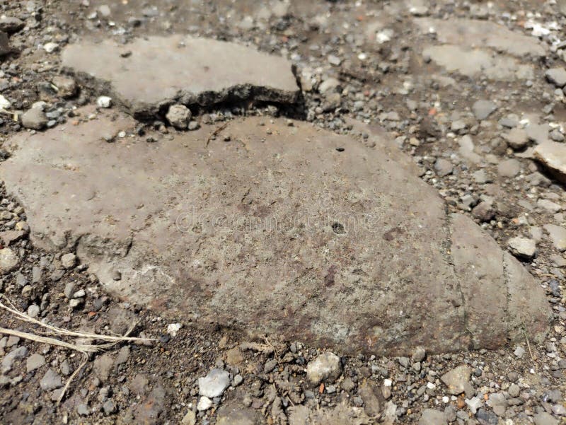 Rocks on rough ground stock photo. Image of floor, flooring - 316489258