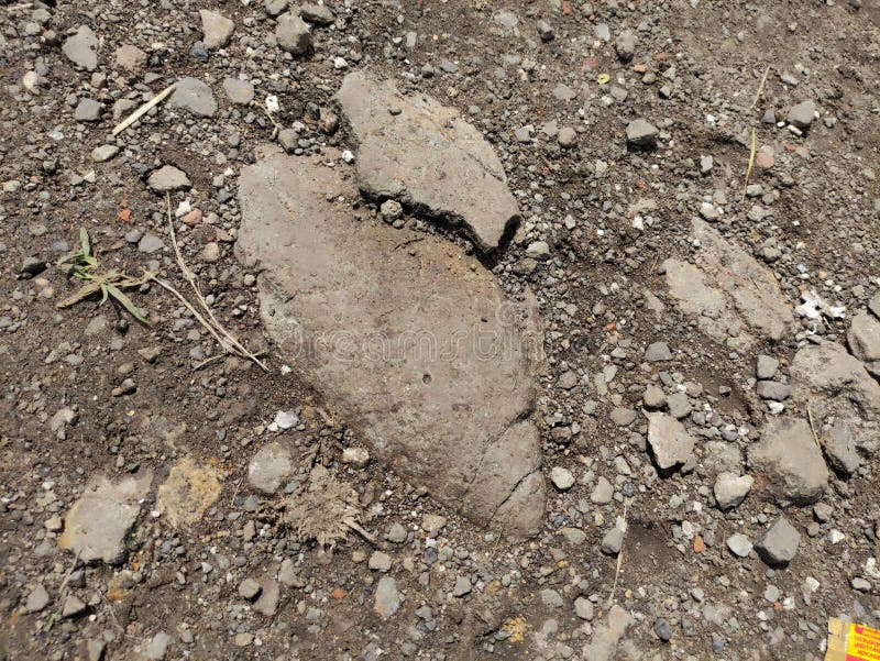 Rocks on rough ground stock photo. Image of detail, flooring - 316489272