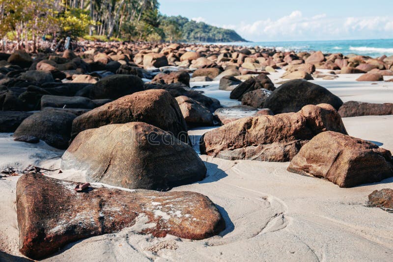 Rocks on Sand Beach at Sea. Stock Photo - Image of granit, blue: 129544040