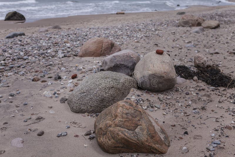 Rocks in sand stock image. Image of stone, tree, waves - 50655187