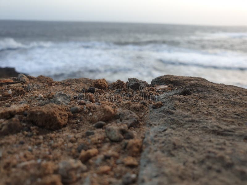Rocks, Sand and the Ocean. Art by Nature Stock Photo - Image of water ...