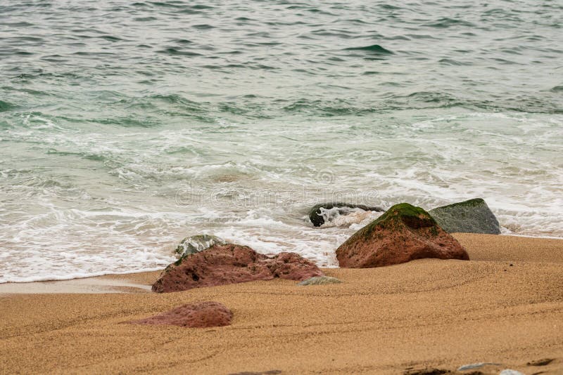 Rocks in the Sand Washed by Waves in Puerto Vallarta, Mexico Stock ...