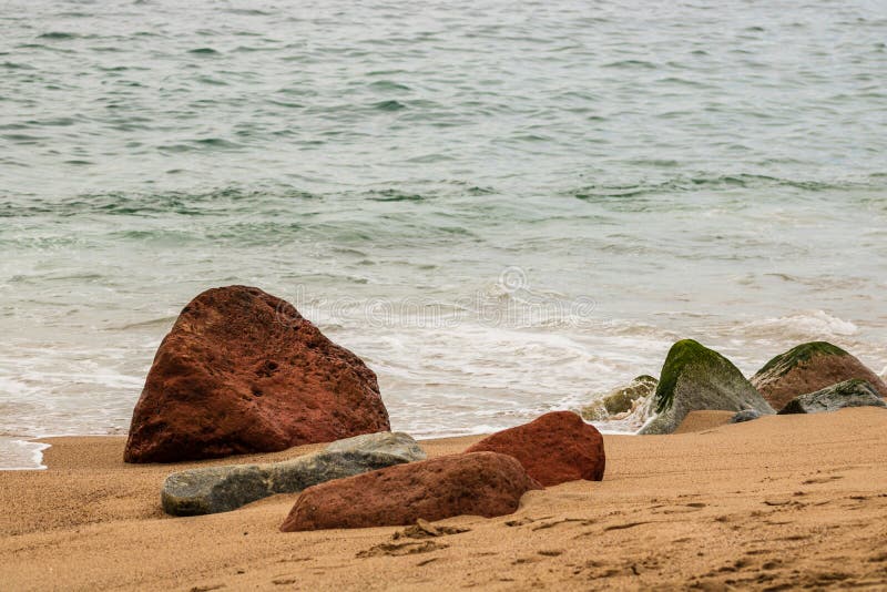 Rocks in the Sand Washed by Waves in Puerto Vallarta, Mexico Stock ...