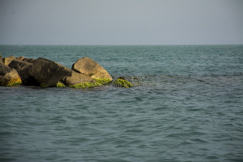 Rocks in the sea stock image. Image of horizon, tide - 127680571