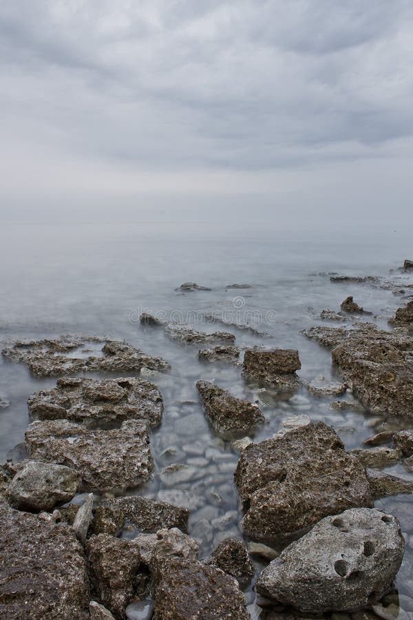 Rocks in the sea stock image. Image of ocean, beach, color - 22000625