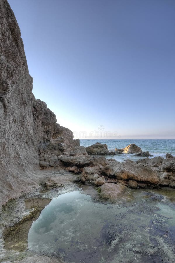 Rocks at sea stock image. Image of colours, coast, reflection - 26603135