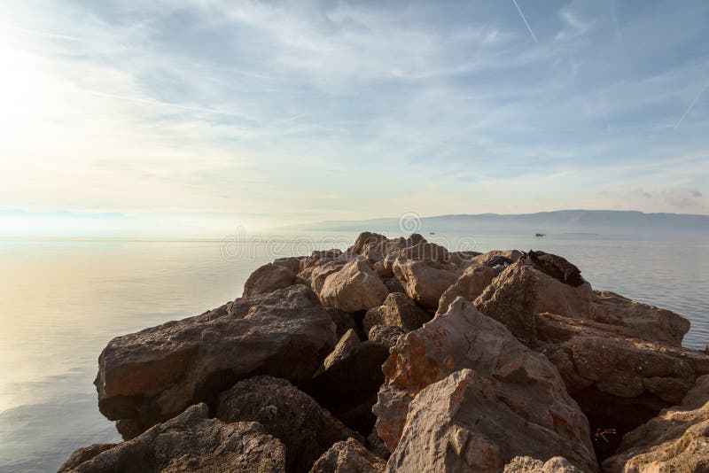 Rocks in the sea stock photo. Image of brown, natural - 48186320