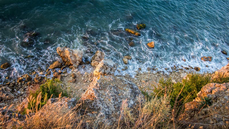 The Rocks and Sea. Dramatic Scene. Composition of Nature. Stock Image ...