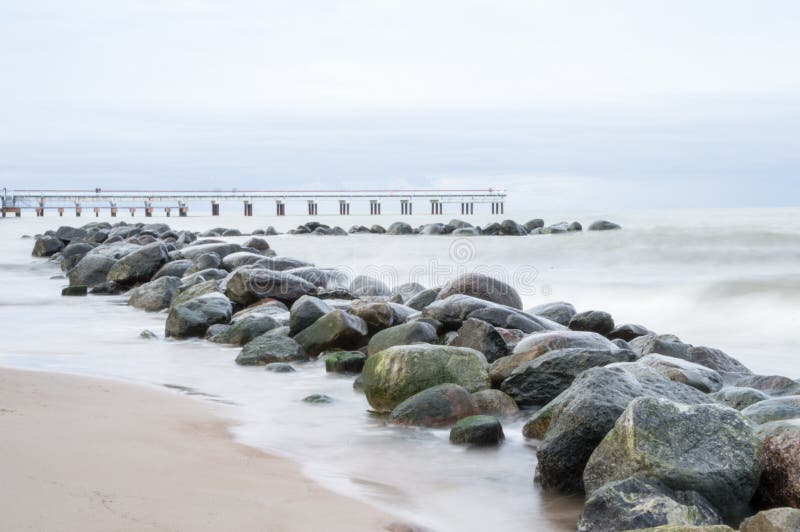 Rocks, sea and pier. stock image. Image of coastline - 36041581