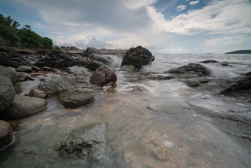 Rocks by the Sea and Rain Clouds Stock Image - Image of cloud, beauty ...