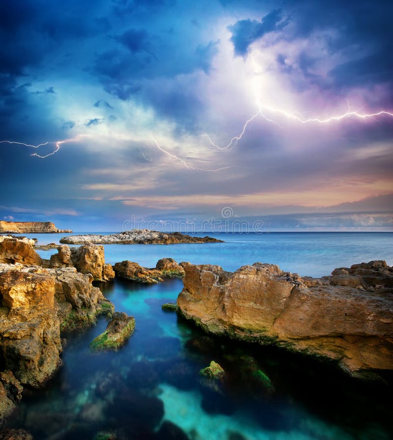 Rocks and sea storm. stock photo. Image of purple, rusty - 27063824