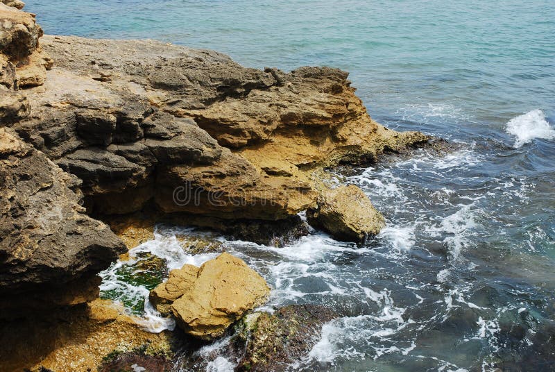 Rocks in the sea stock photo. Image of headland, ocean - 93293508
