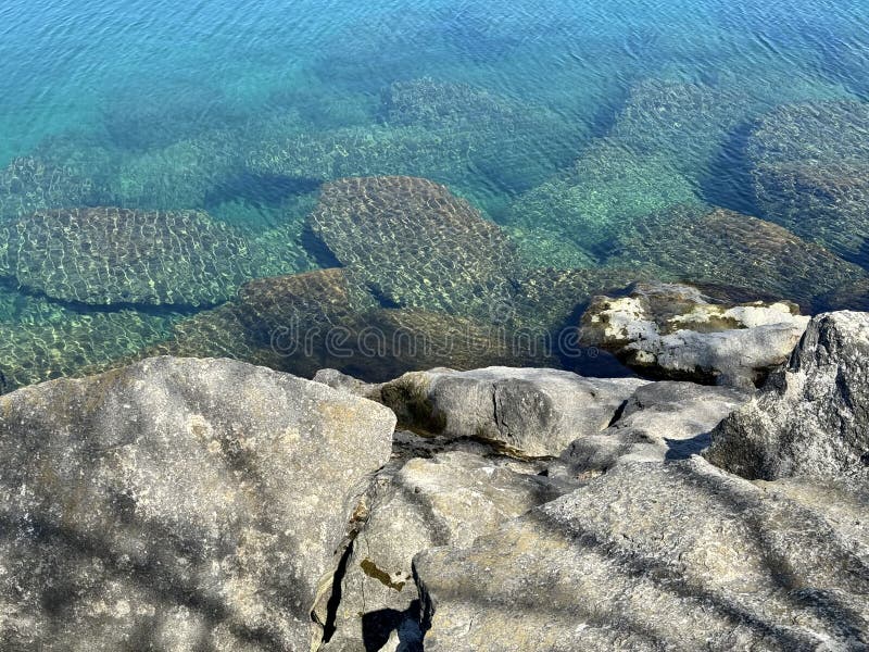 Rocks in the Sea. Tree Fragments from Water. Sea Landscape with Rocks ...