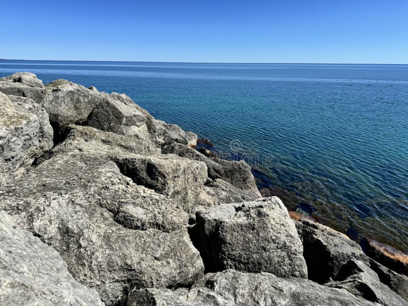 Rocks in the Sea. Tree Fragments from Water. Sea Landscape with Rocks ...
