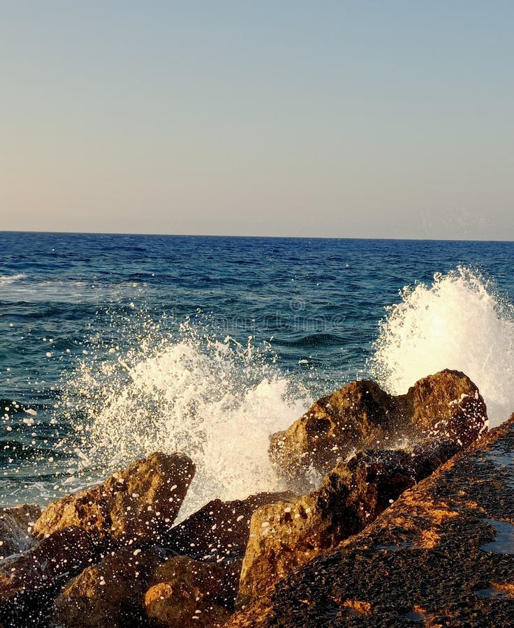 Rocks in the sea stock image. Image of rocks, water - 251558147