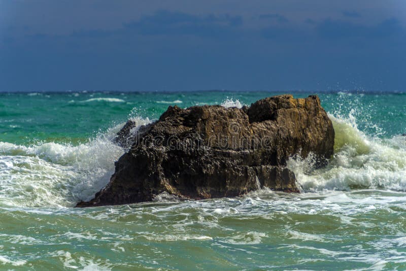 Rocks in the sea and waves stock image. Image of coast - 231856995