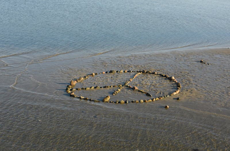 Rocks Shaping a Peace Sign on a Beach Stock Photo - Image of symbol ...