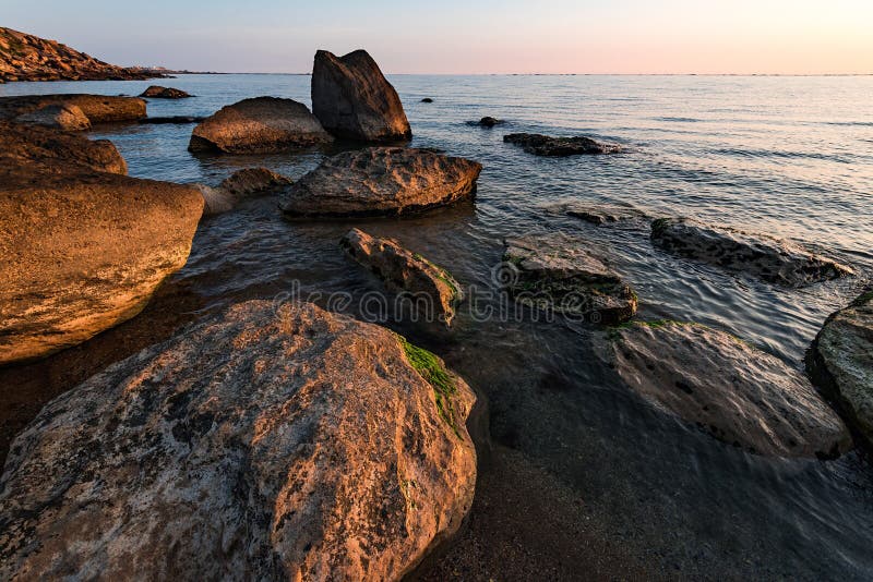 Rocks on shore stock image. Image of overflow, pellucid - 70188855