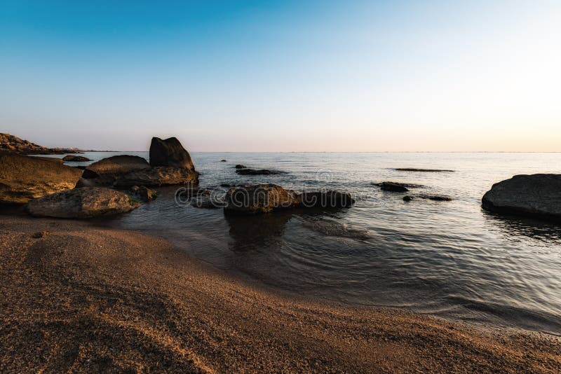 Rocks on shore stock photo. Image of limpid, boulders - 70189422