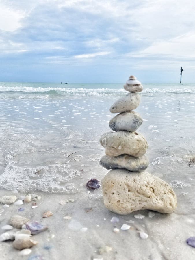 Rocks Stacked Near the Water on the Beach Stock Photo - Image of foam ...