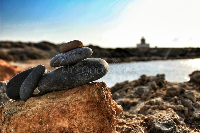 Rocks stacked on the shore stock image. Image of pebble - 122803451