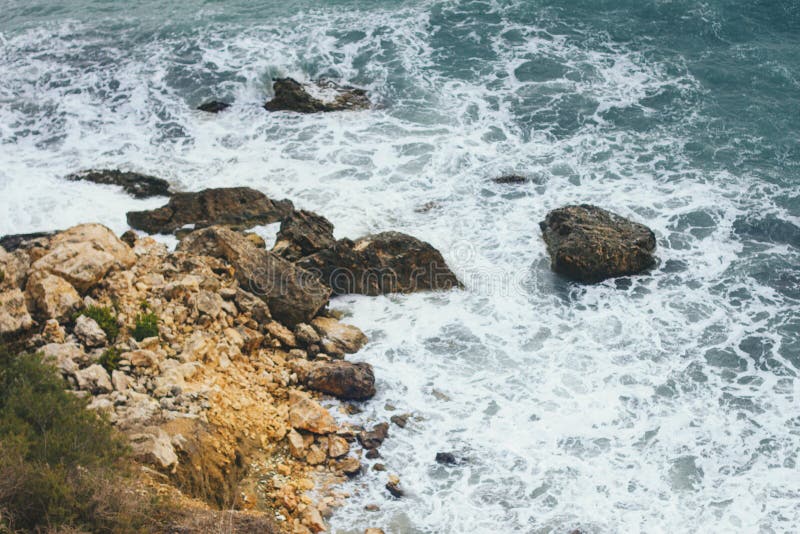 Rocks and Stones on the Beach Surrounded by Water during Daytime Stock ...